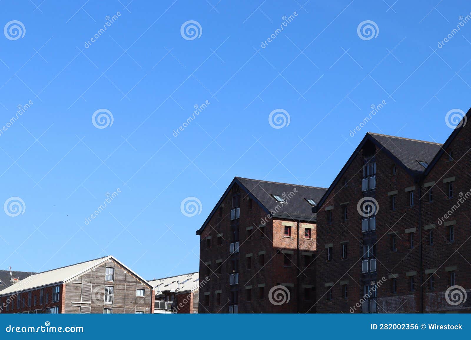 Two Tall Brick Structures Standing Side by Side Illuminated by the ...