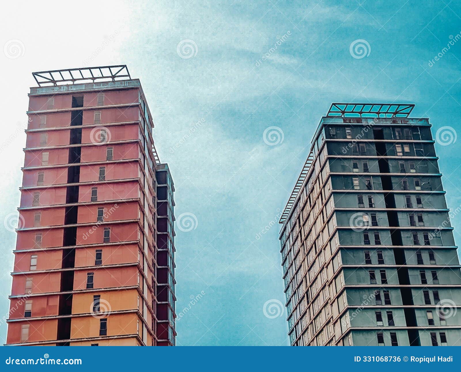 Two Tall Buildings Facing Each Other Stock Photo - Image of tall, cloud ...