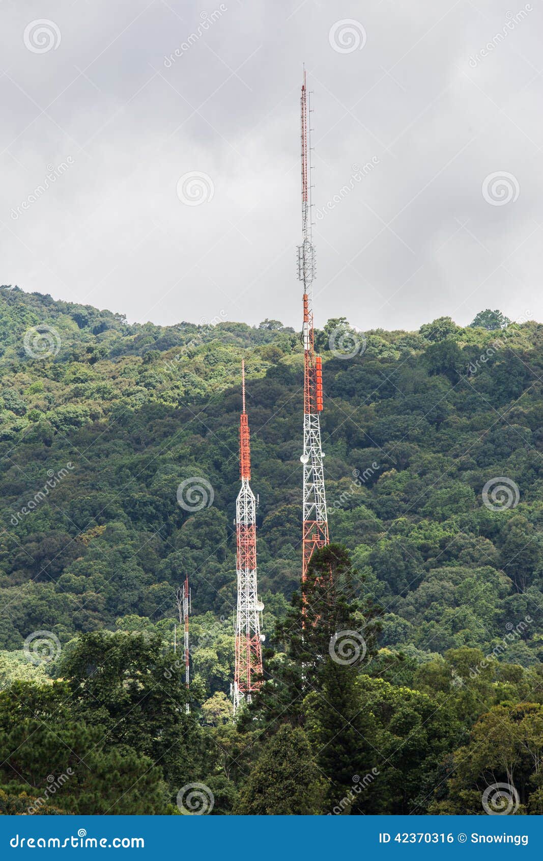 Two Tall Transformer Towers Line a Forested Hillside. Stock Photo ...