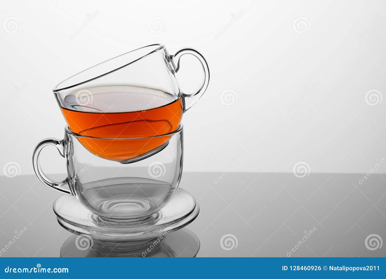 Two Tea Cups with Tea on a White Background. Stock Photo - Image of ...