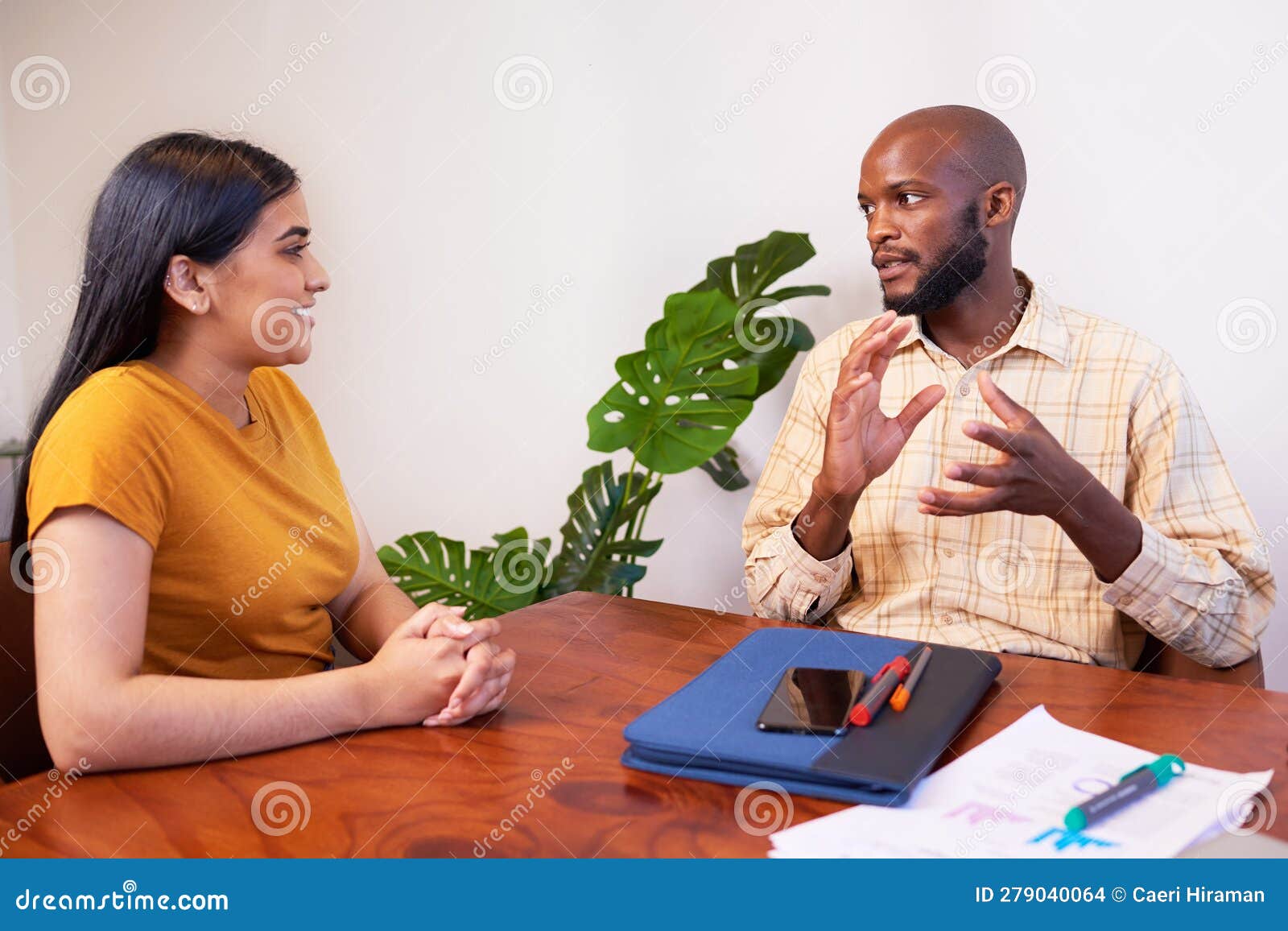 Two Team Members in a Discussion at Boardroom Table, Hand Gestures ...