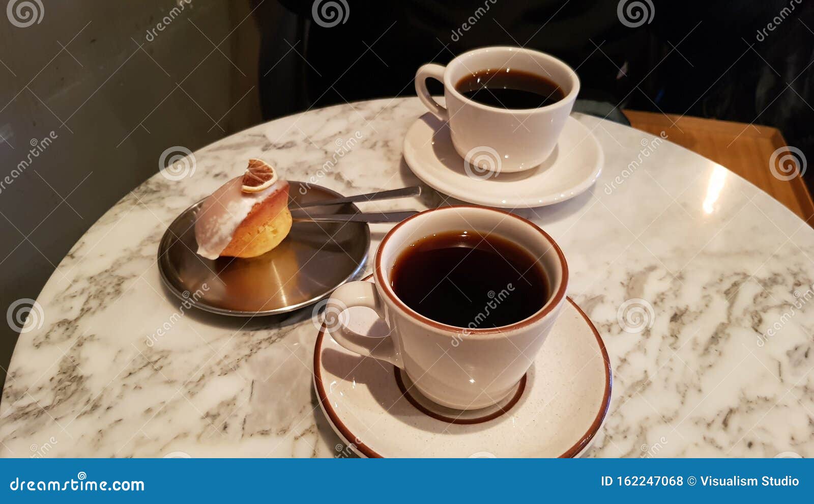 Two Teas in a Cup with a Cream Sandwich on a Plate Stock Photo - Image ...