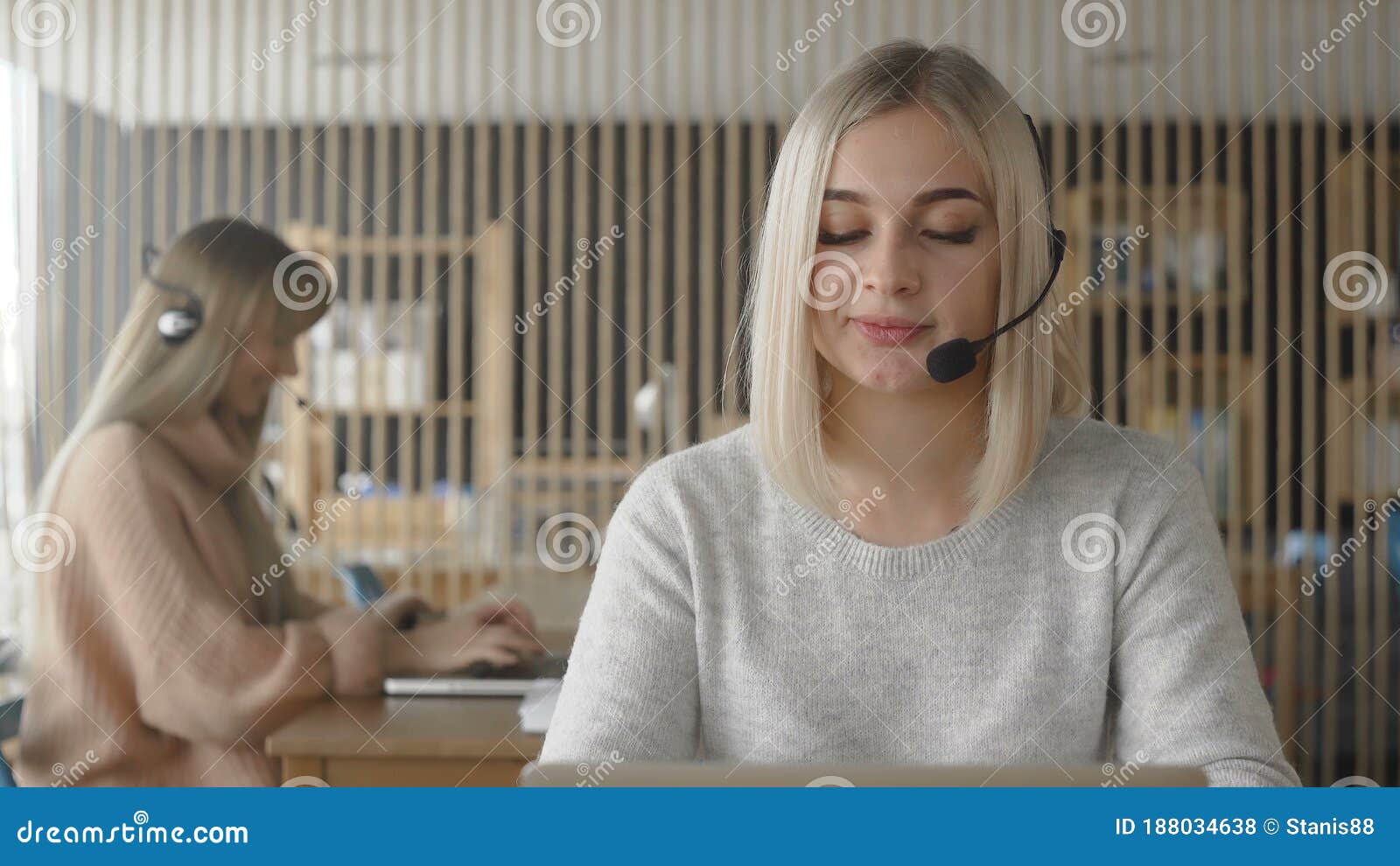 Two Technical Support Specialist Talking with Customers by Headsets ...