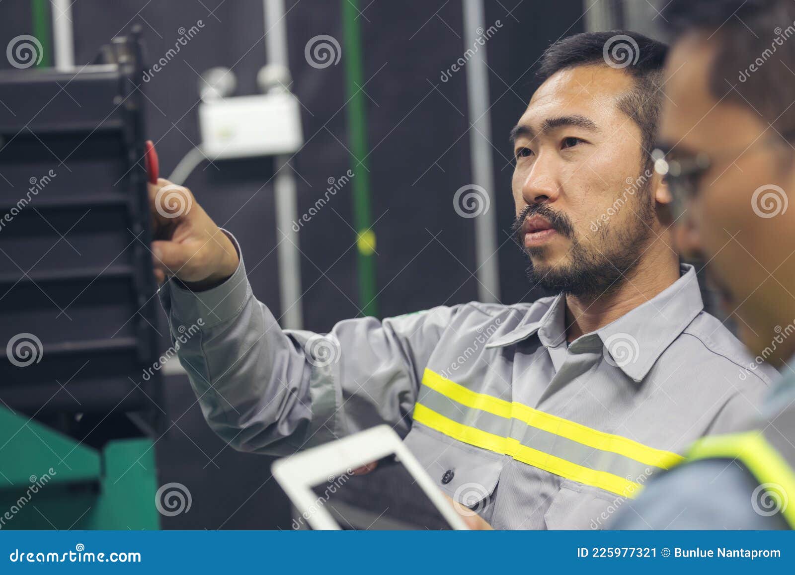 Two Technical Workers with Tablets Working in an Industry Factory`s ...
