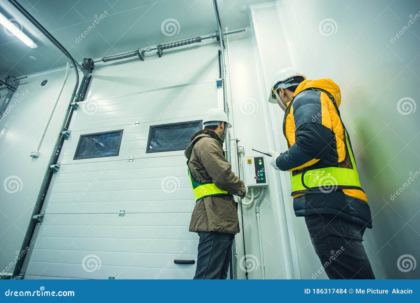 Two Technician Inspector Check Machine Shelf in Cold Warehouse. Stock ...