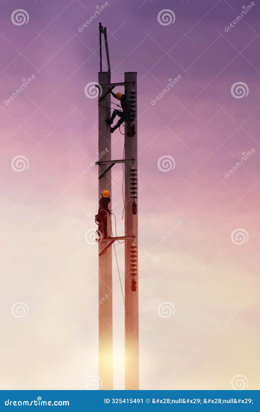 Two Technicians Climb Light Pole To Install Electrical Lighting System ...