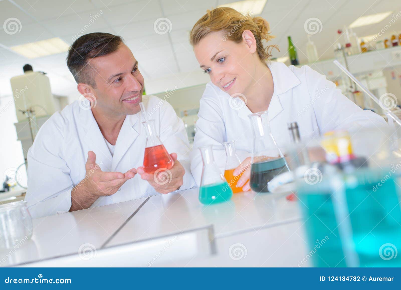 Two Technicians Discussing Results Stock Photo - Image of liquid, flask ...