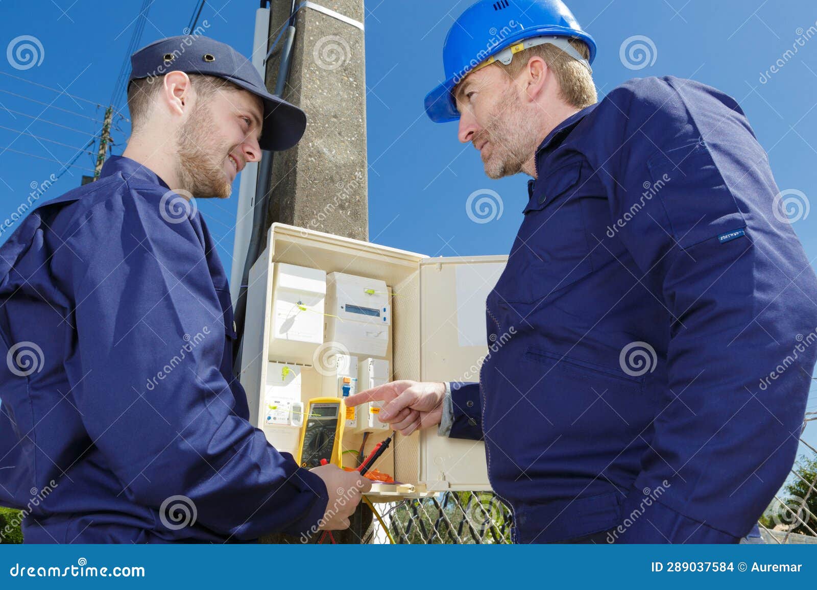Two Technicians Working on Communication Towers Stock Photo - Image of ...