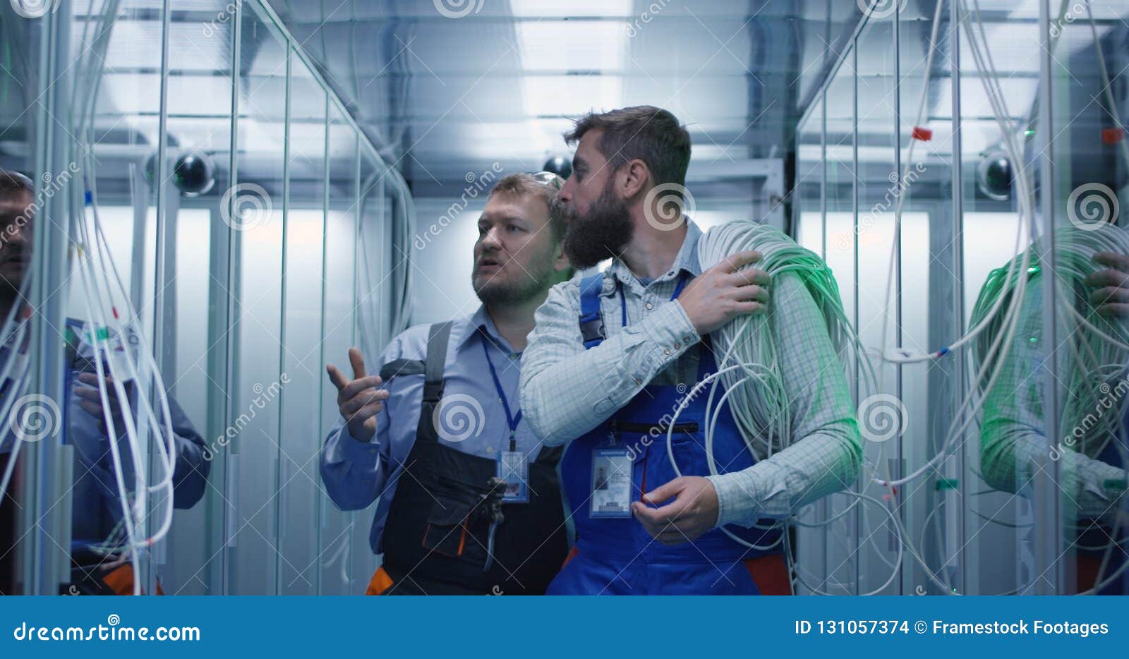 Two Technicians Working in a Data Center Stock Photo - Image of ...