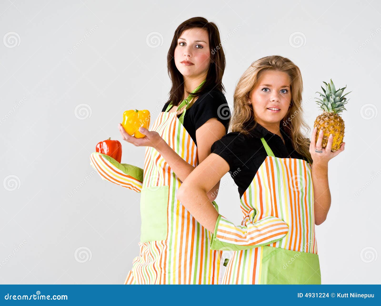 Two teenage cooks stock photo. Image of female, aprons - 4931224