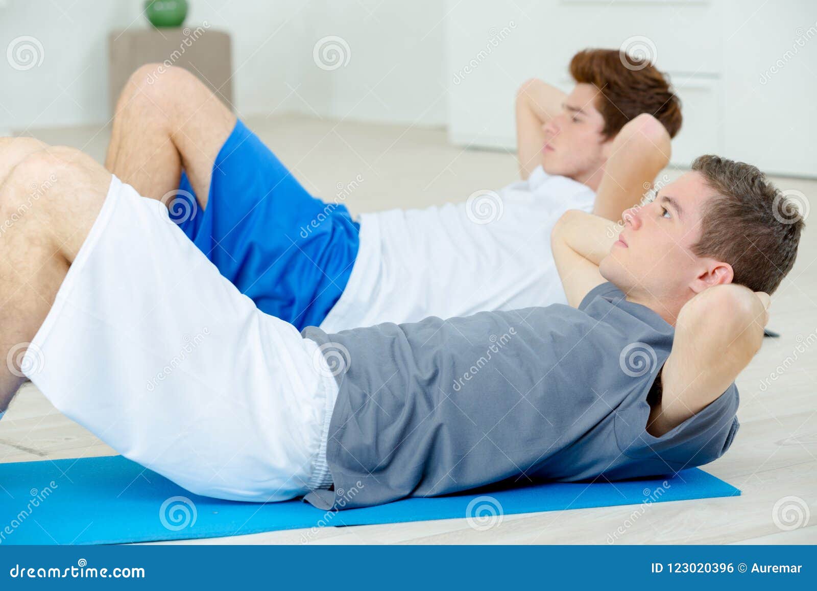 Two Teenage Friends Doing Sit Ups Stock Photo - Image of situps ...