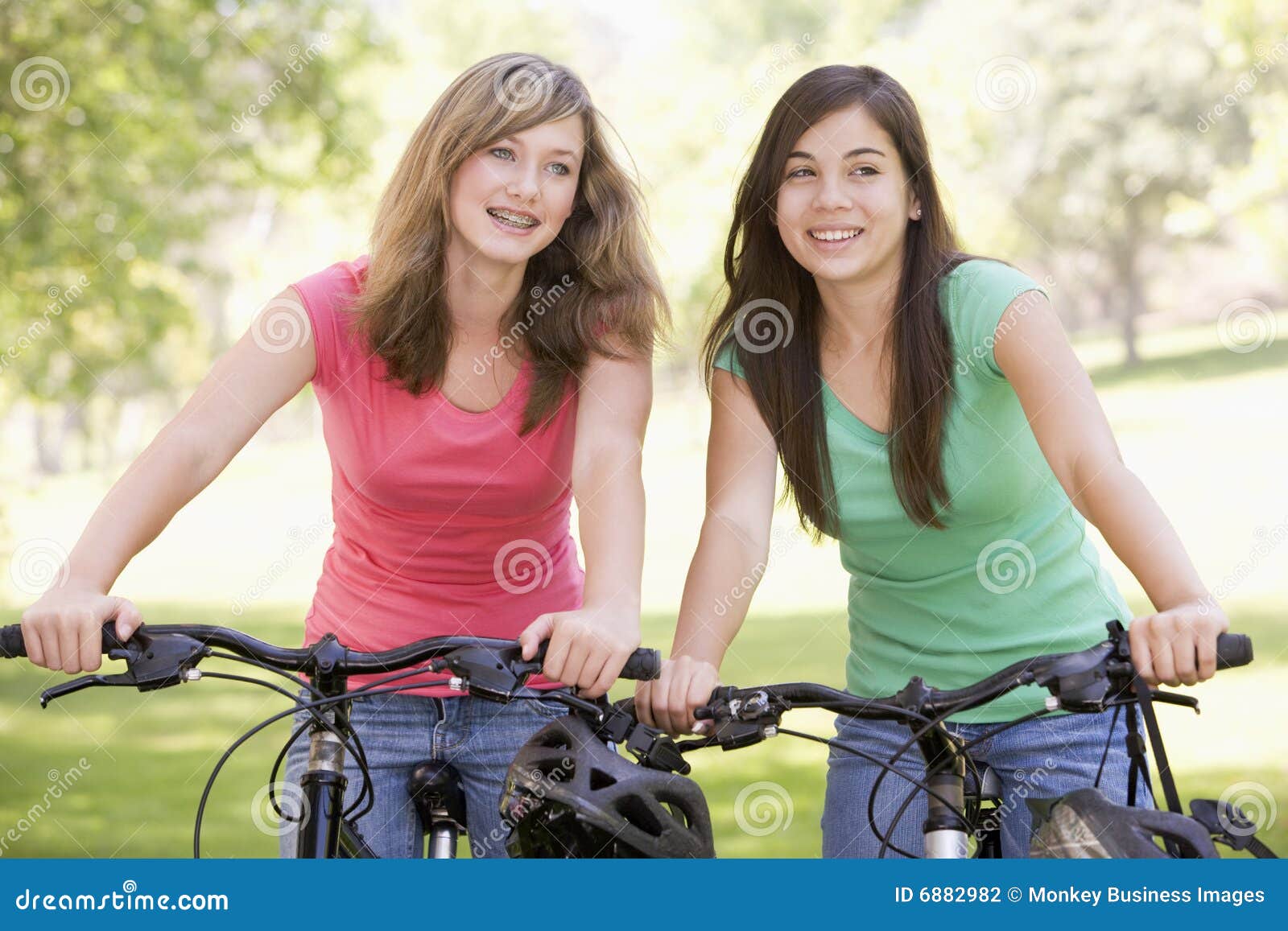 Two Teenagers on Bicycles stock photo. Image of friends - 6882982