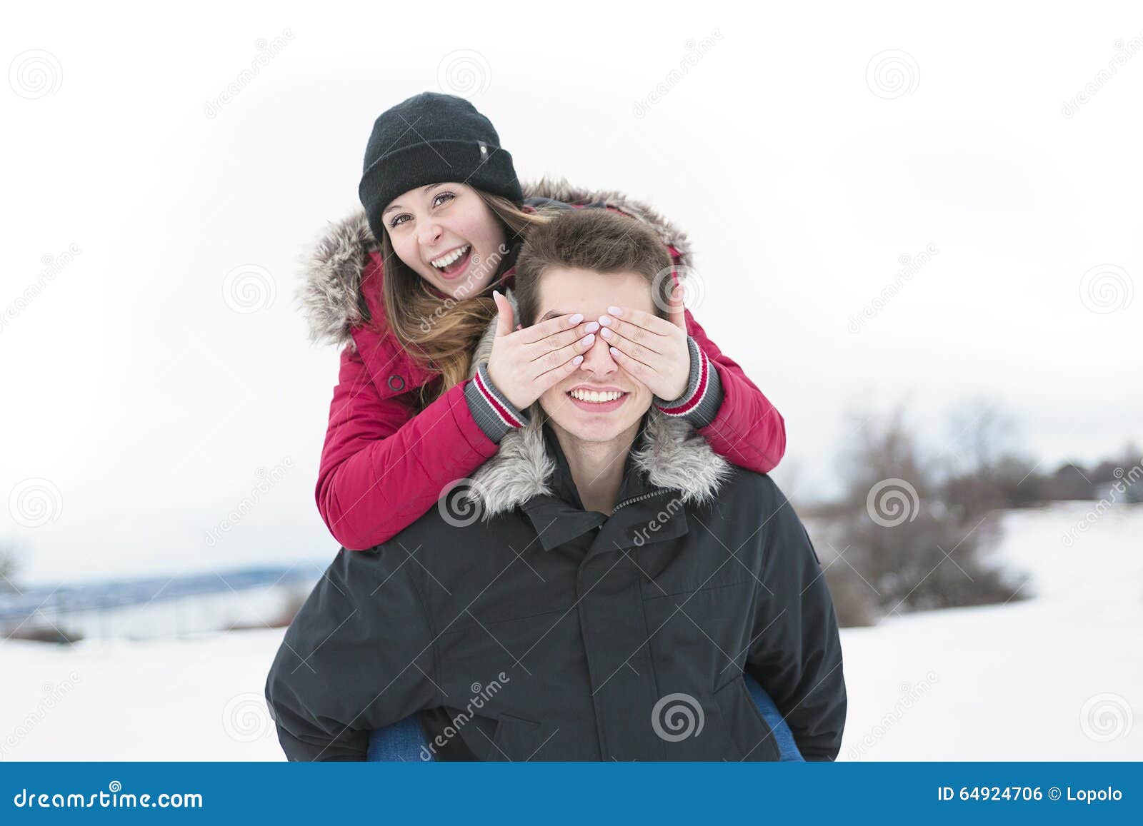 Two Teenagers Havinf Fun on the Snow Field Stock Photo - Image of girl ...