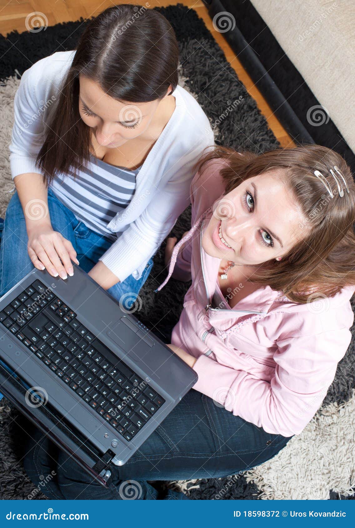 Two teens with laptop stock photo. Image of female, enjoy - 18598372