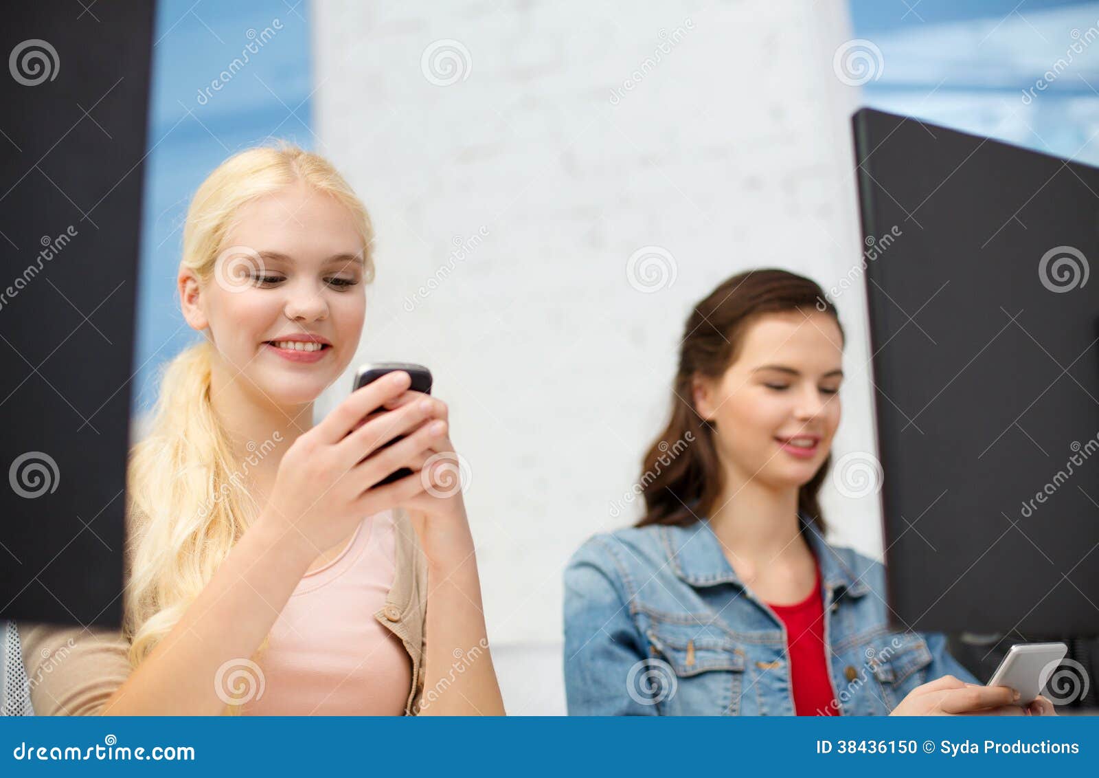 Two Teens with Smartphones in Computer Class Stock Photo - Image of ...