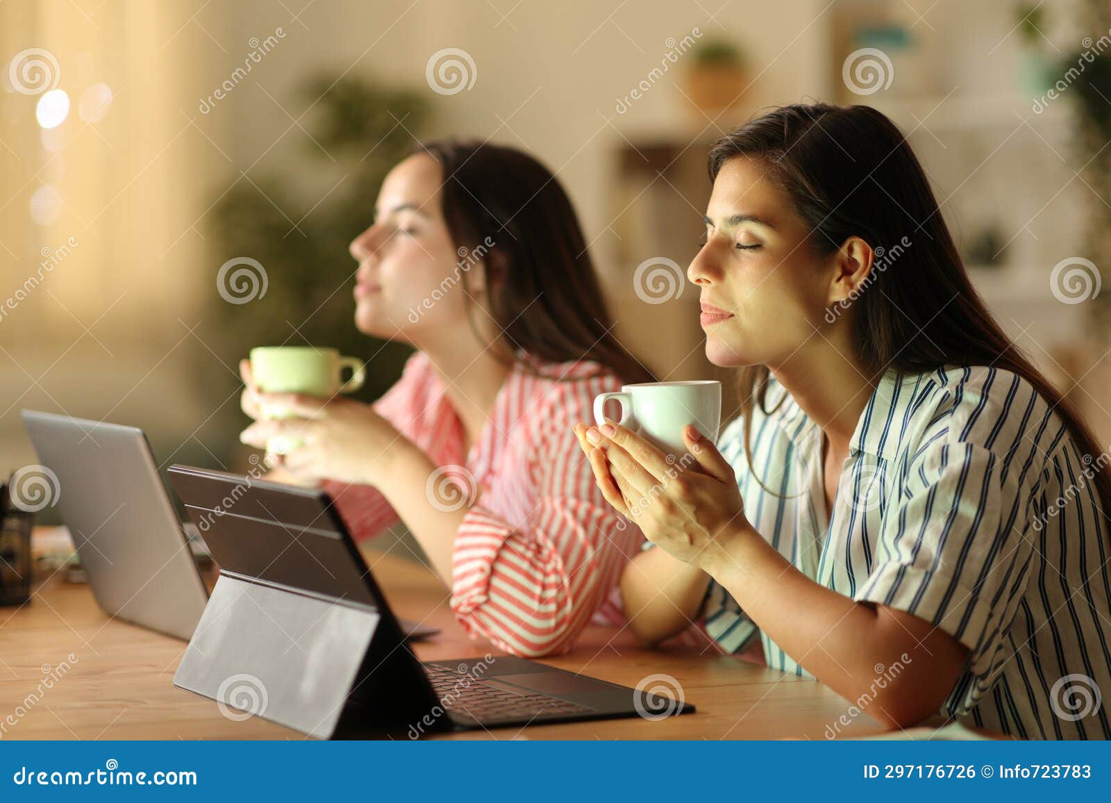 Two Tele Workers Relaxing Drinking Coffee in the Night Stock Photo ...
