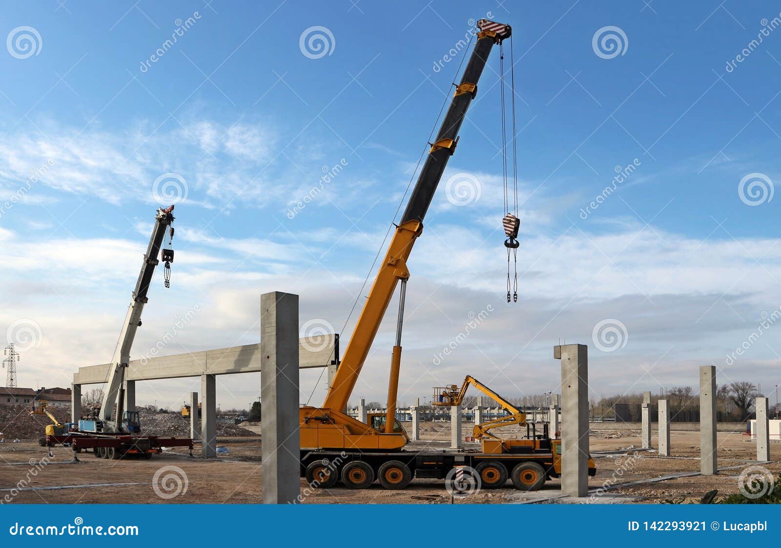 Two Telescopic Cranes and Cherry Picker among the Supporting Columns of ...