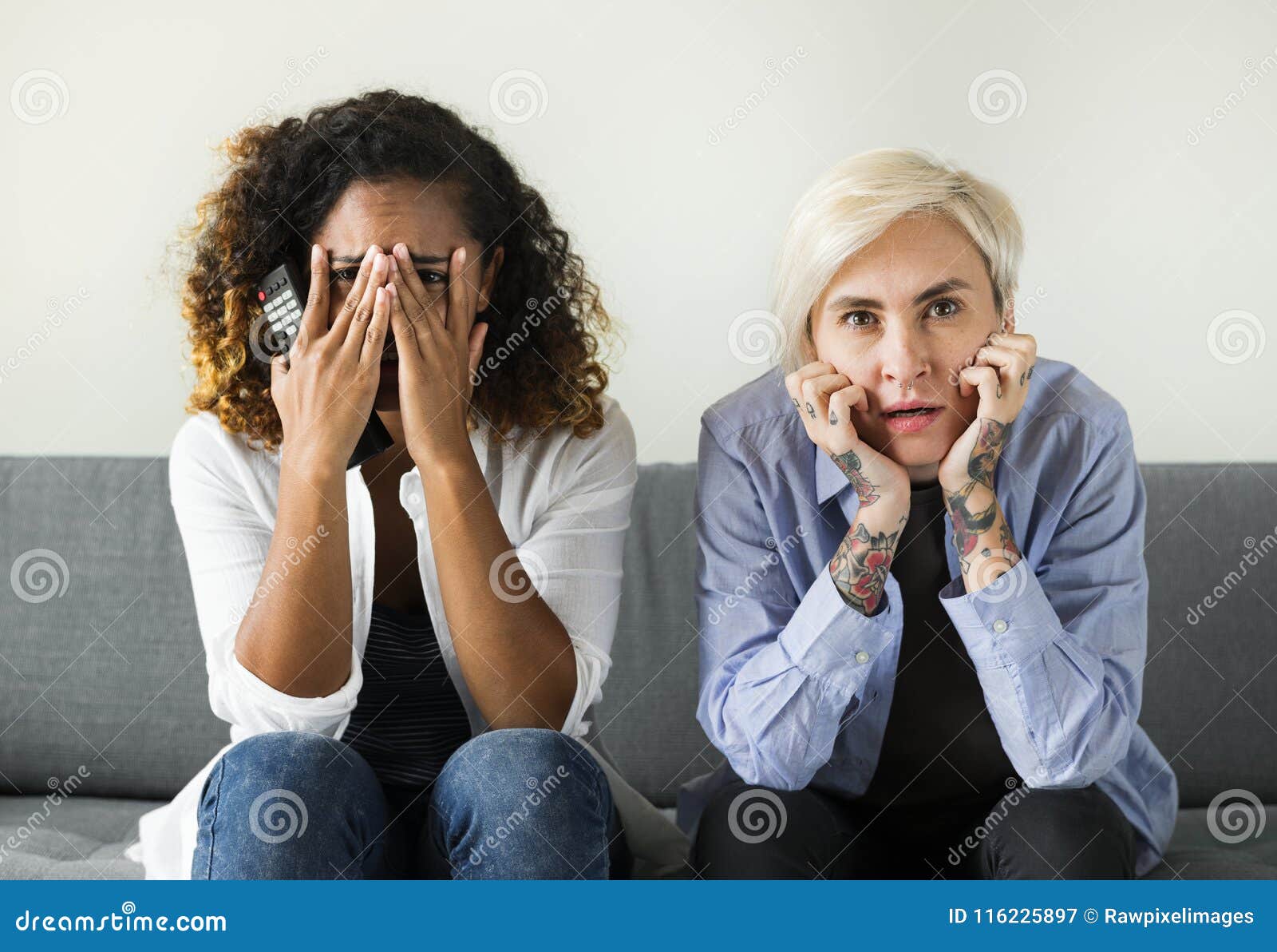 Two Terrified Girls on a Couch Stock Image - Image of fearful, looking ...