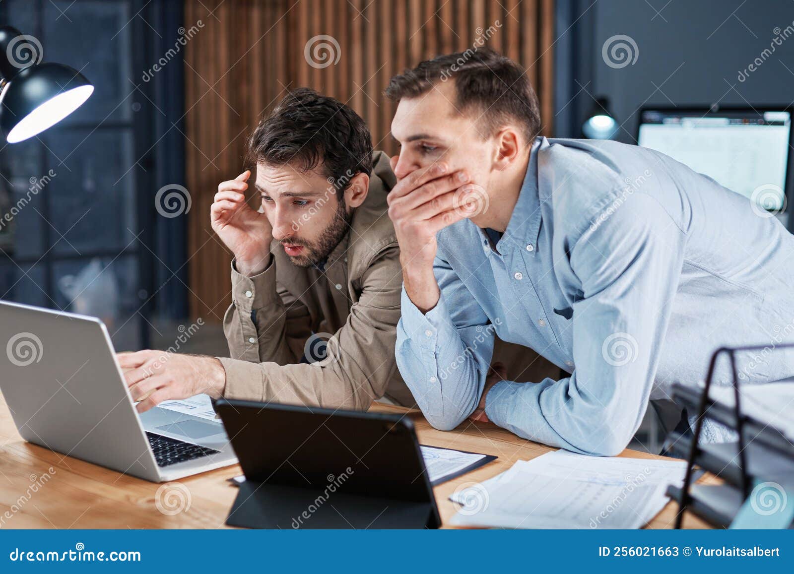 Two Tired Employees Working with Financial Documents until Late at ...