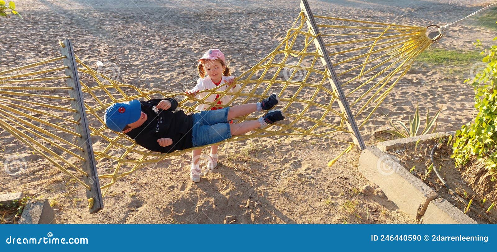 Two Toddlers Having Fun with Hammock on the Beach Stock Photo - Image ...