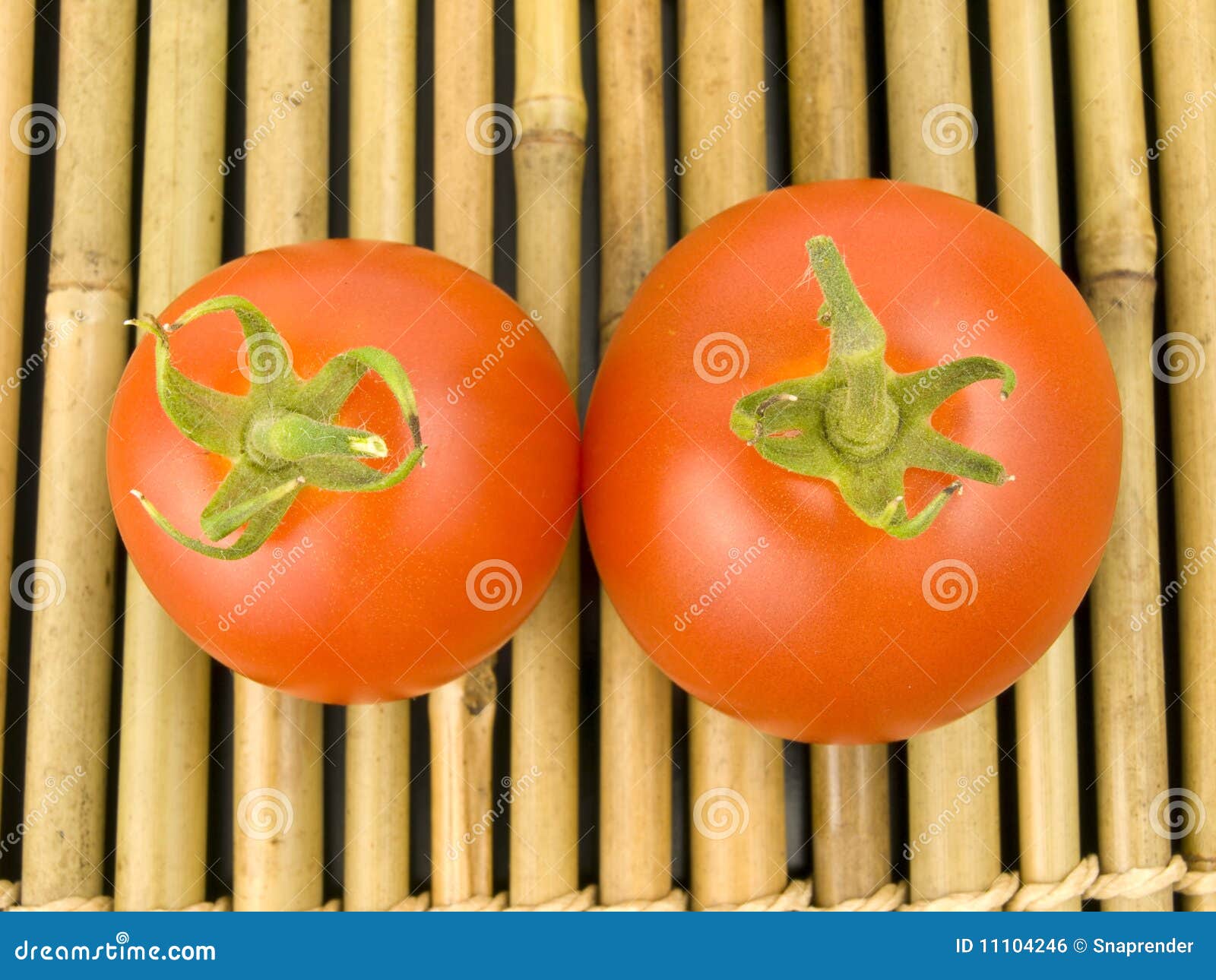 Two Tomatoes on Bamboo stock photo. Image of healthy - 11104246