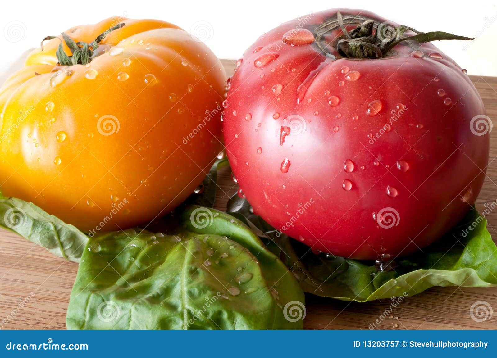 Two Tomatos stock image. Image of table, food, herb, yellow - 13203757
