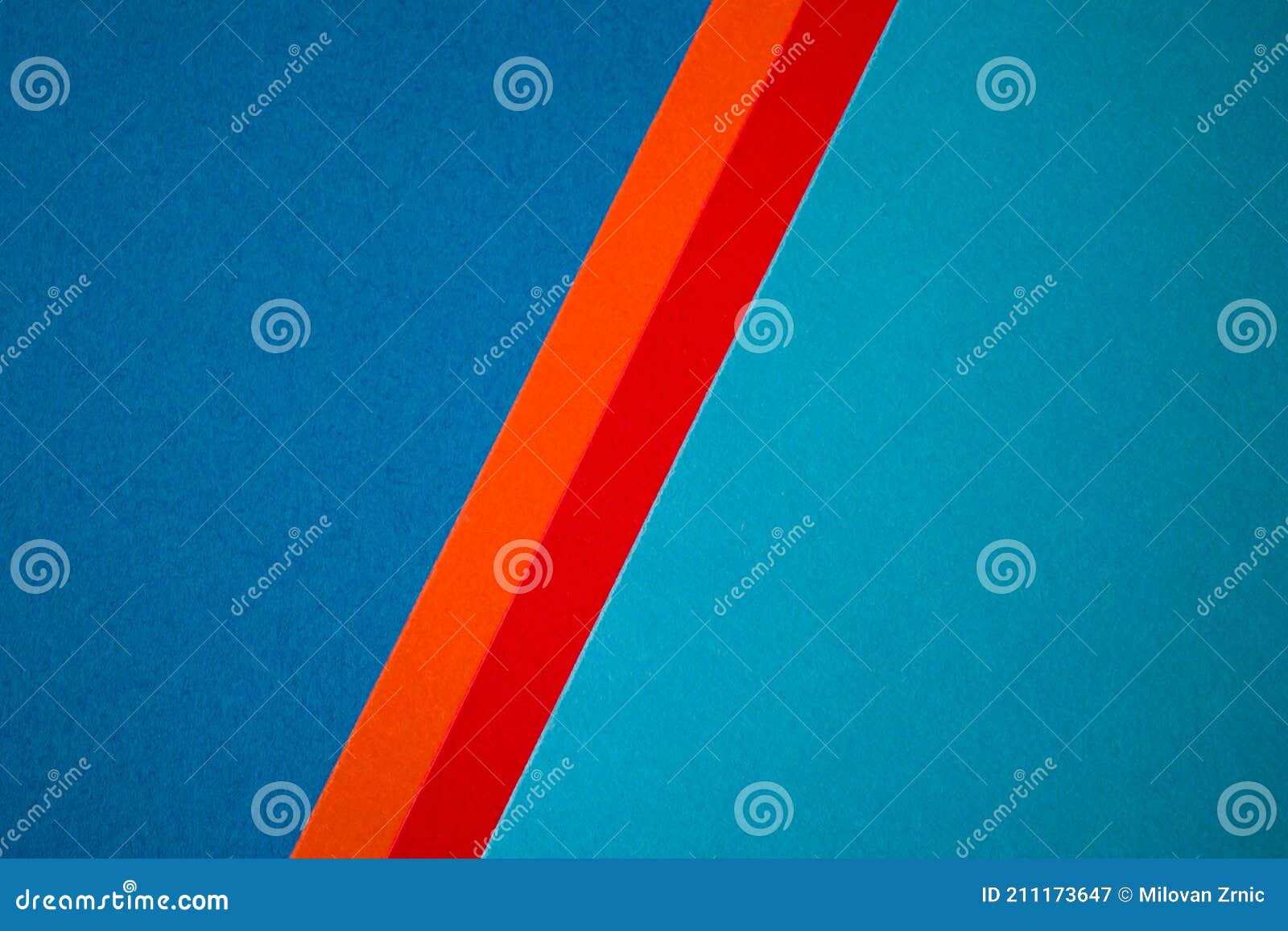 Two Tone Blue Colored Paper Divided with Red and Orange Stripes ...