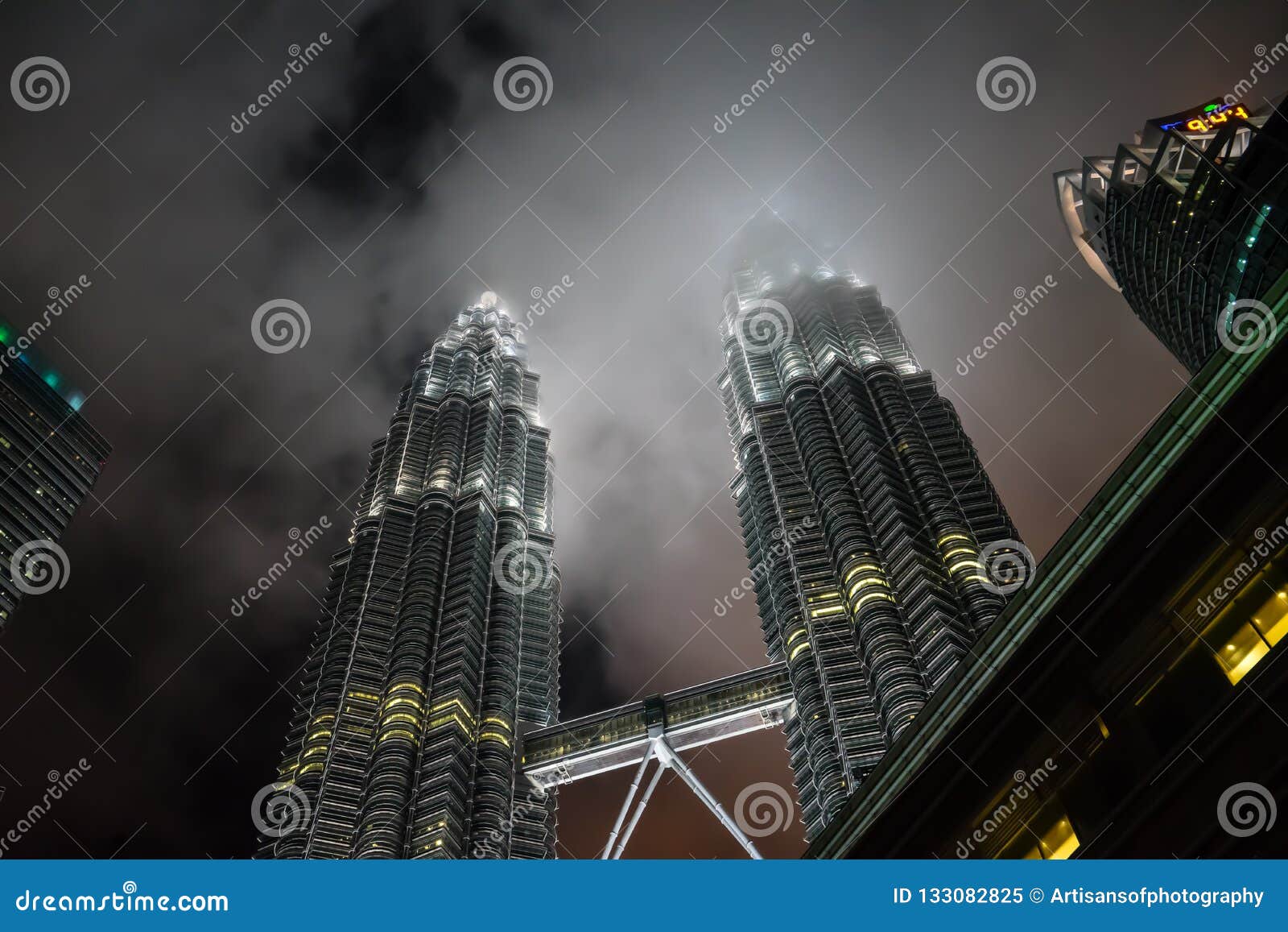 Two Towers Poking through the Hazy Night Sky Stock Image - Image of ...