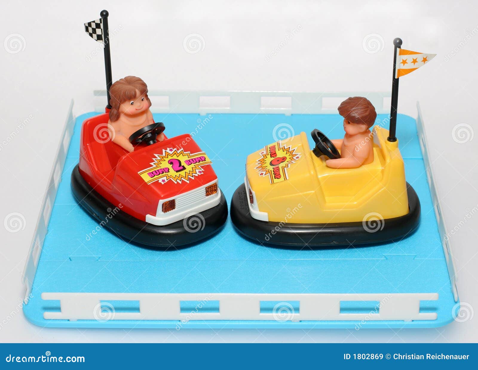 Two toy bump cars in cage stock image. Image of yellow - 1802869
