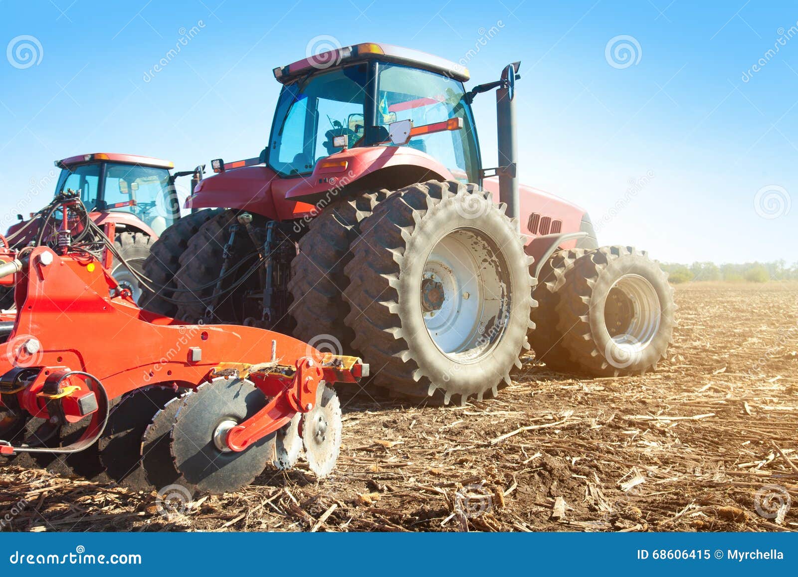 Two tractors in a field stock image. Image of nature - 68606415