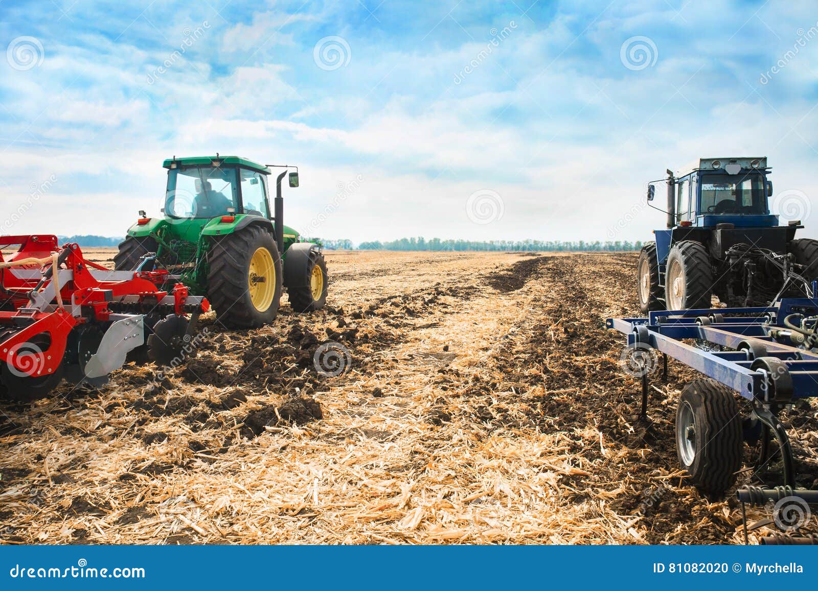 Two tractors in a field. stock photo. Image of industry - 81082020