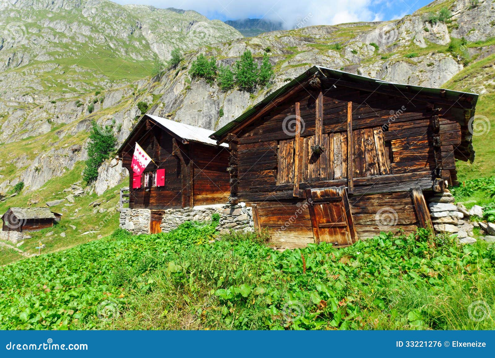 Two Traditional Alpine Huts Stock Photo - Image of mountain, lawn: 33221276