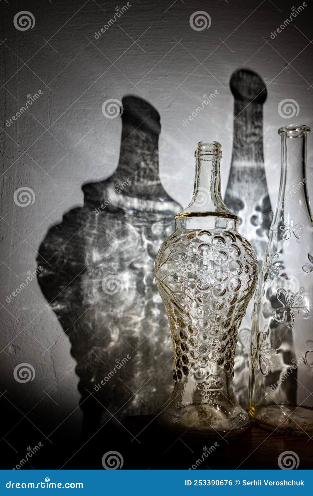 Two Transparent Vintage Bottles and an Abstract Shadow from Them on the ...