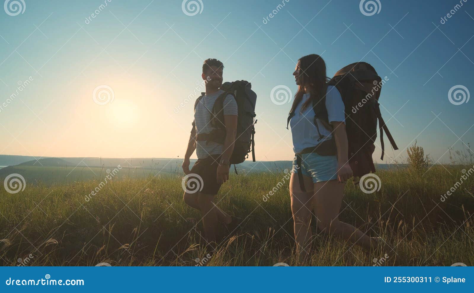 The Two Travelers Walking with Backpacks on a Blue Sky Background ...