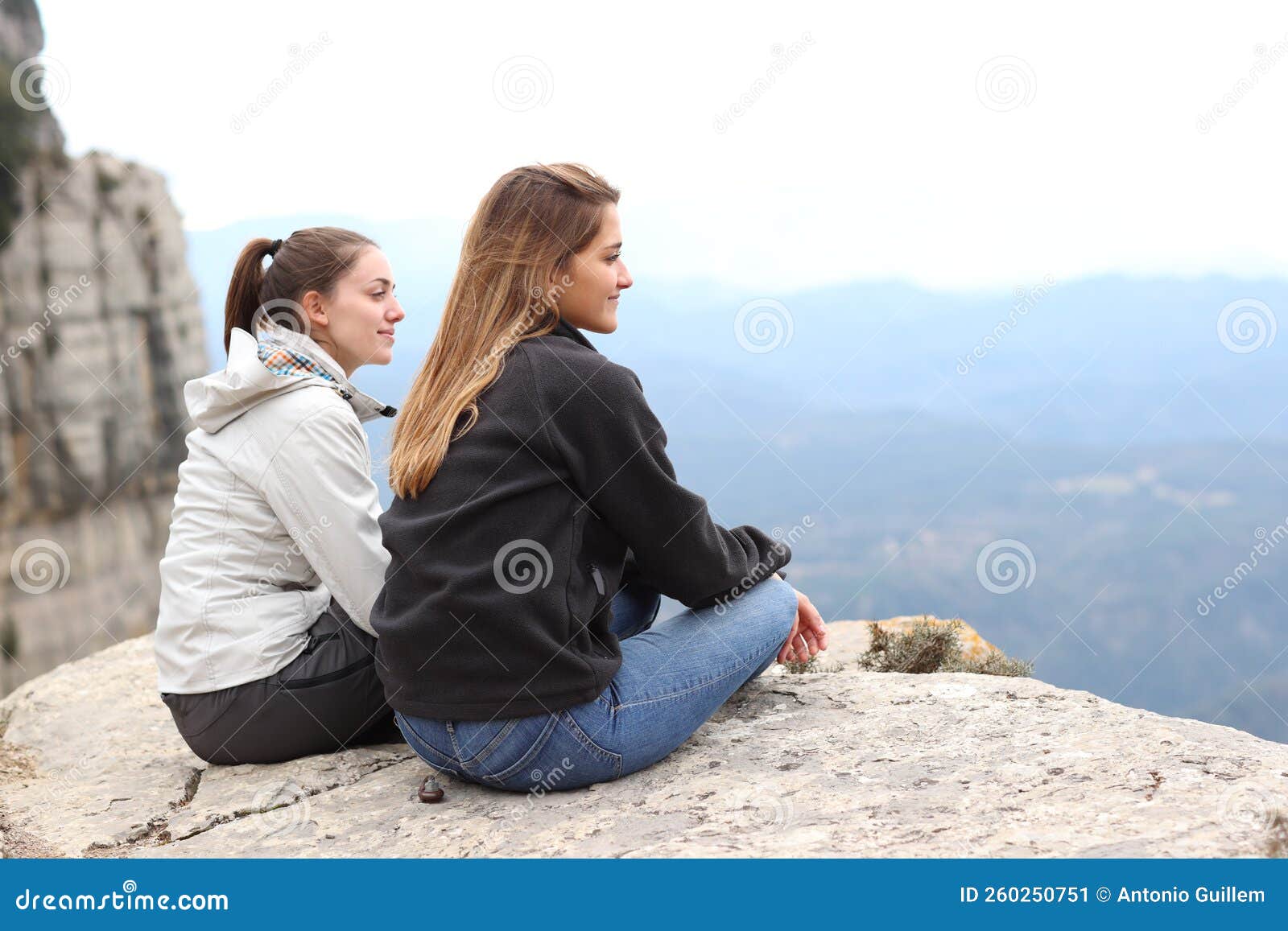 Two Trekkers Contemplating Views from Cliff Stock Image - Image of ...