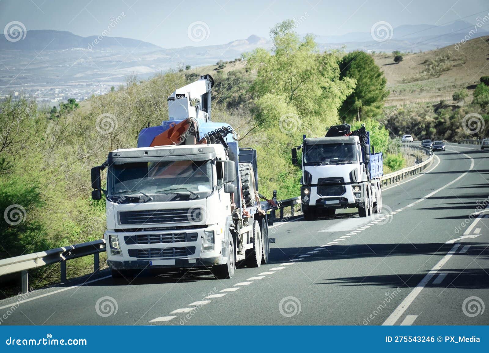Two Trucks with Construction Equipment on a Road Stock Photo - Image of ...