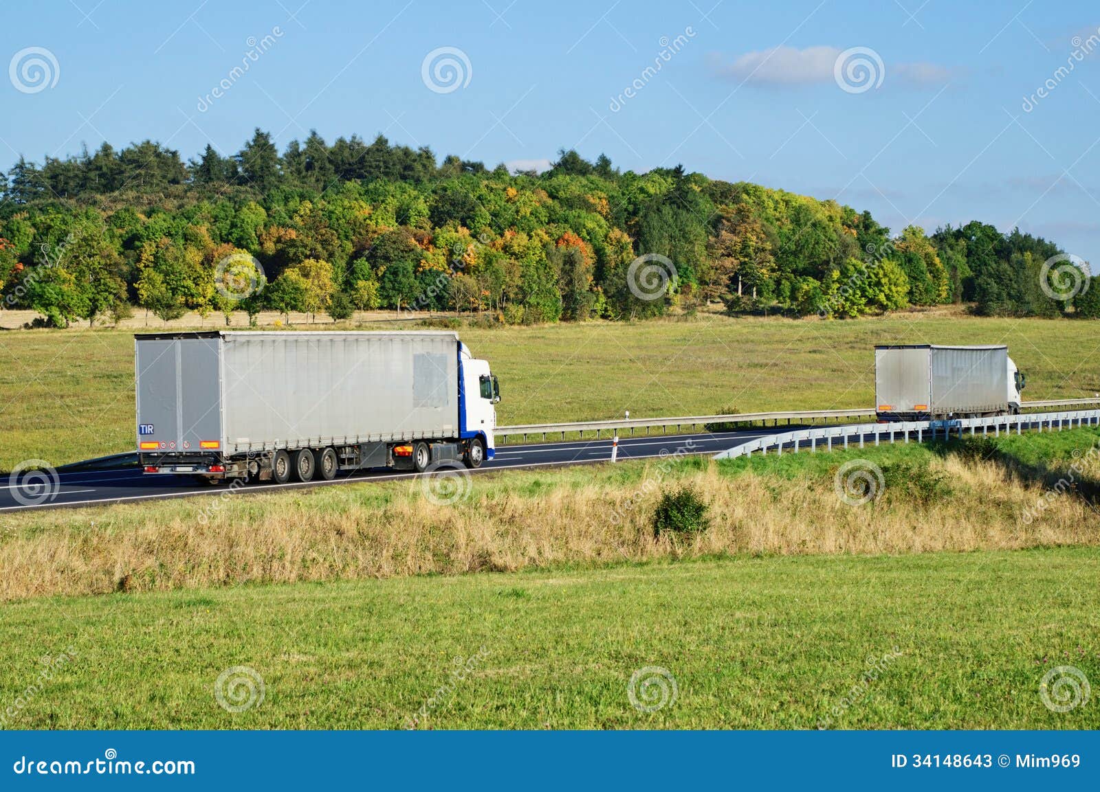 Two Trucks on the Road in the Countryside Stock Image - Image of brown ...