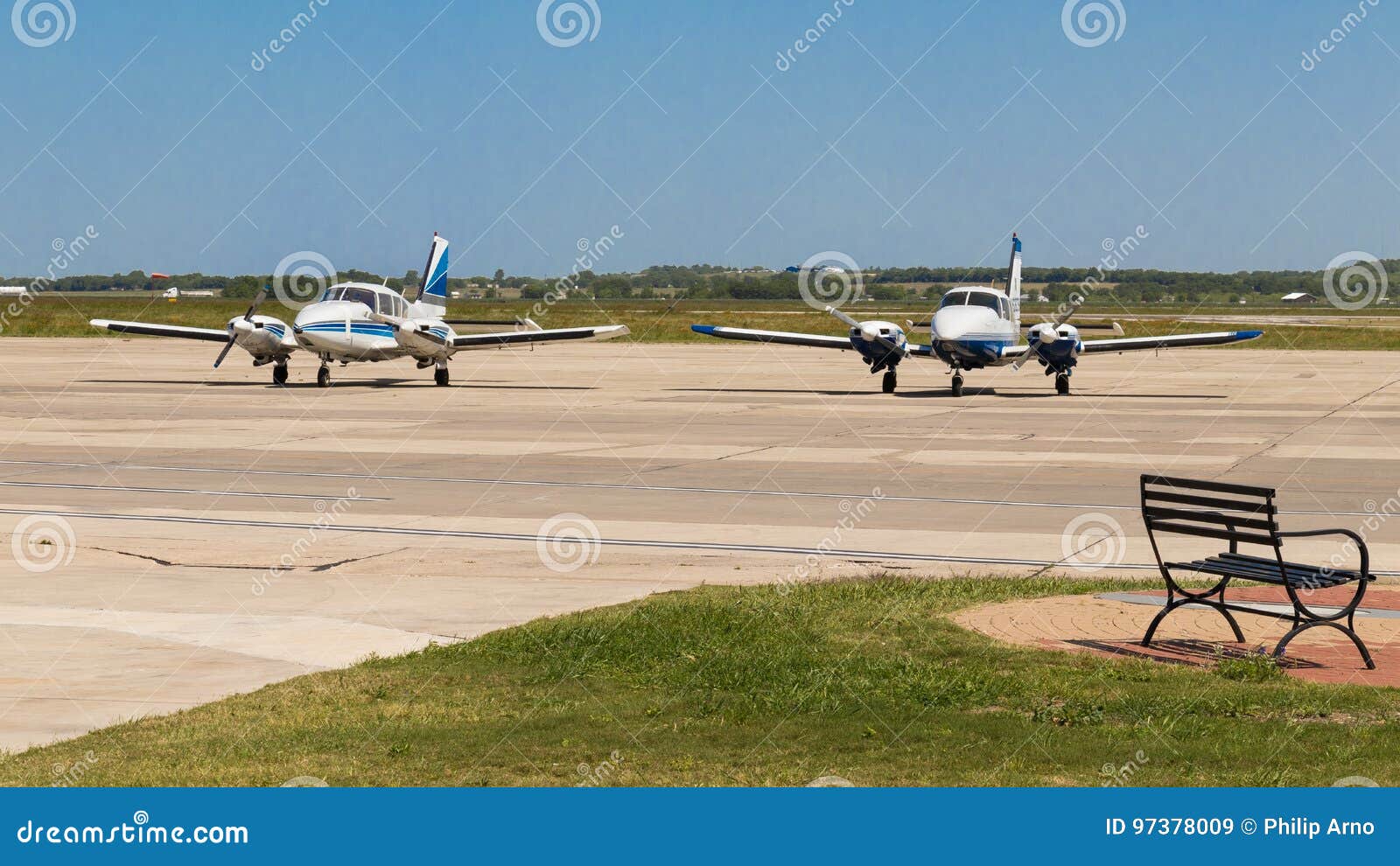 Two Twin Engine Planes at an Airfield Editorial Stock Image - Image of ...