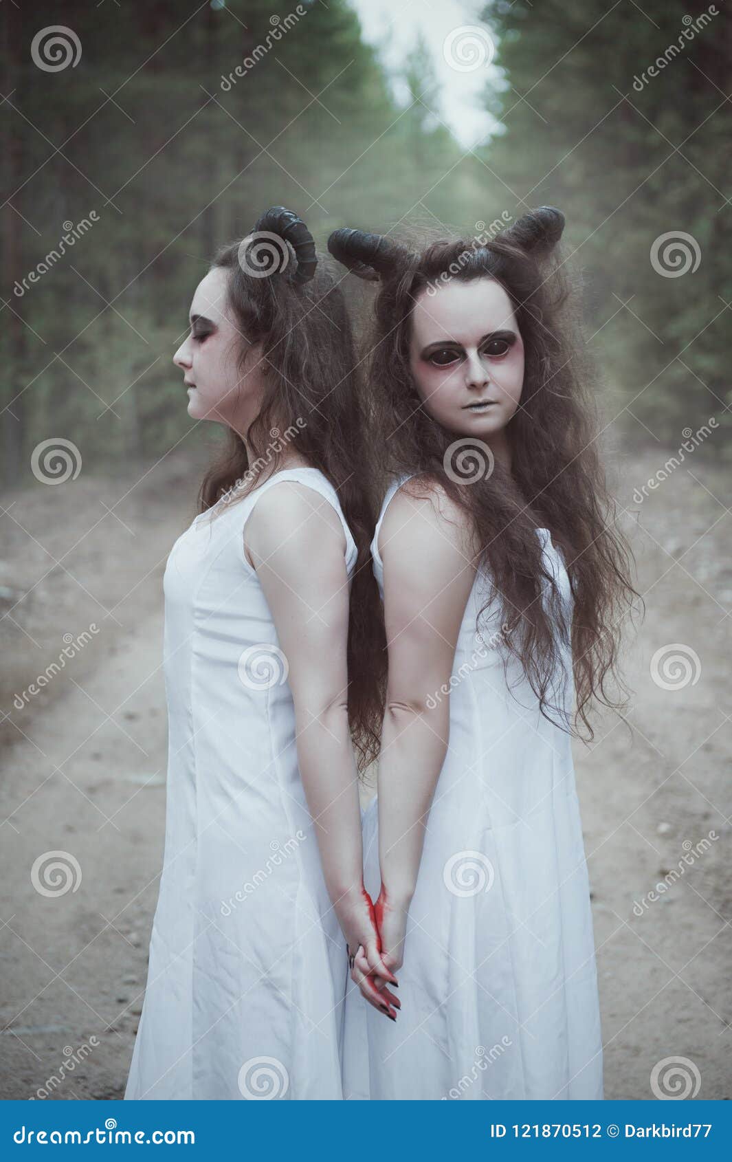 Two Twins Demons with Horns in Forest Stock Photo - Image of death ...