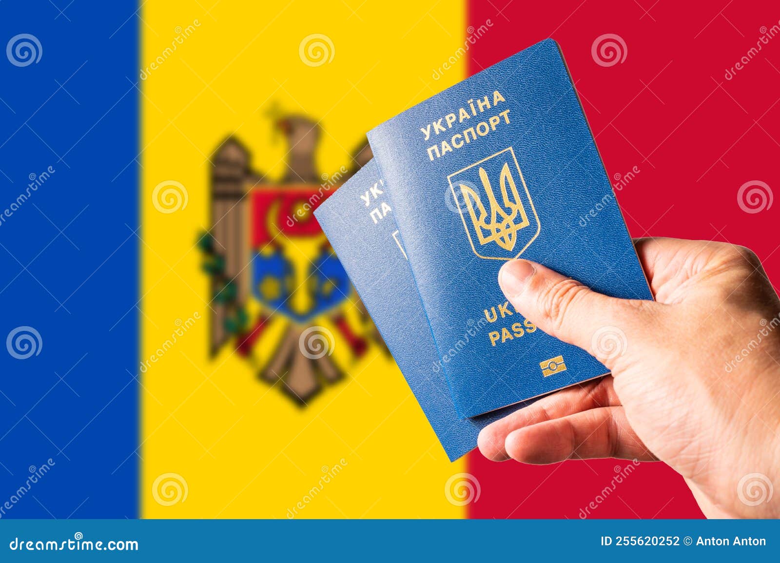 Two Ukrainian Biometric Passports In A Man`s Hand Against The