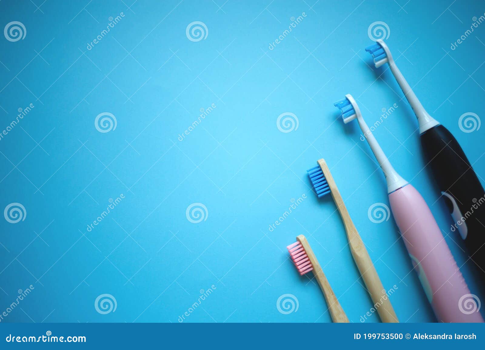 Two Ultrasonic Electric Toothbrushes on a Blue Background Stock Photo ...
