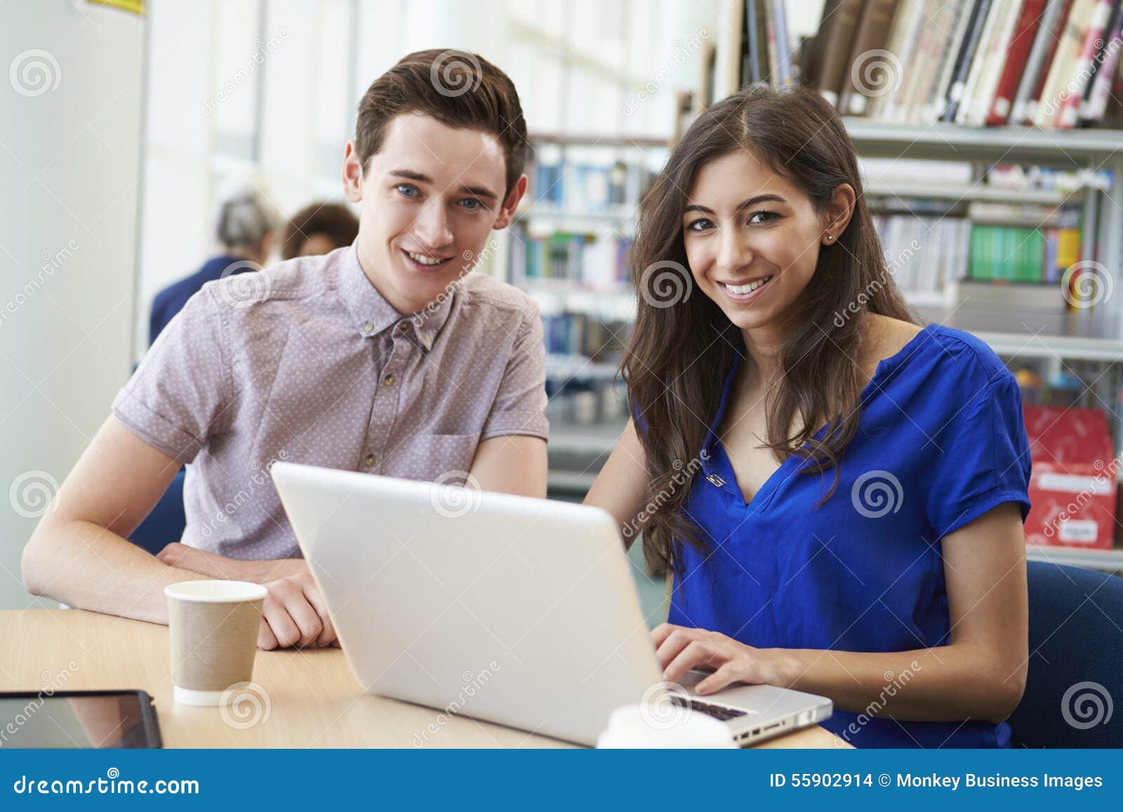 Two University Students Working in Library Using Laptop Stock Photo ...