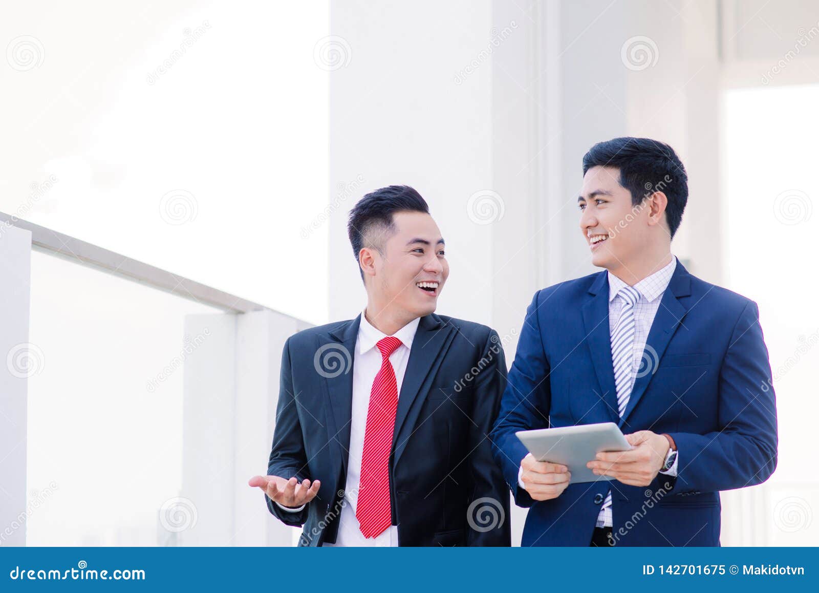 Two Vietnamese Male Coworkers Talking and Smiling Stock Image - Image ...