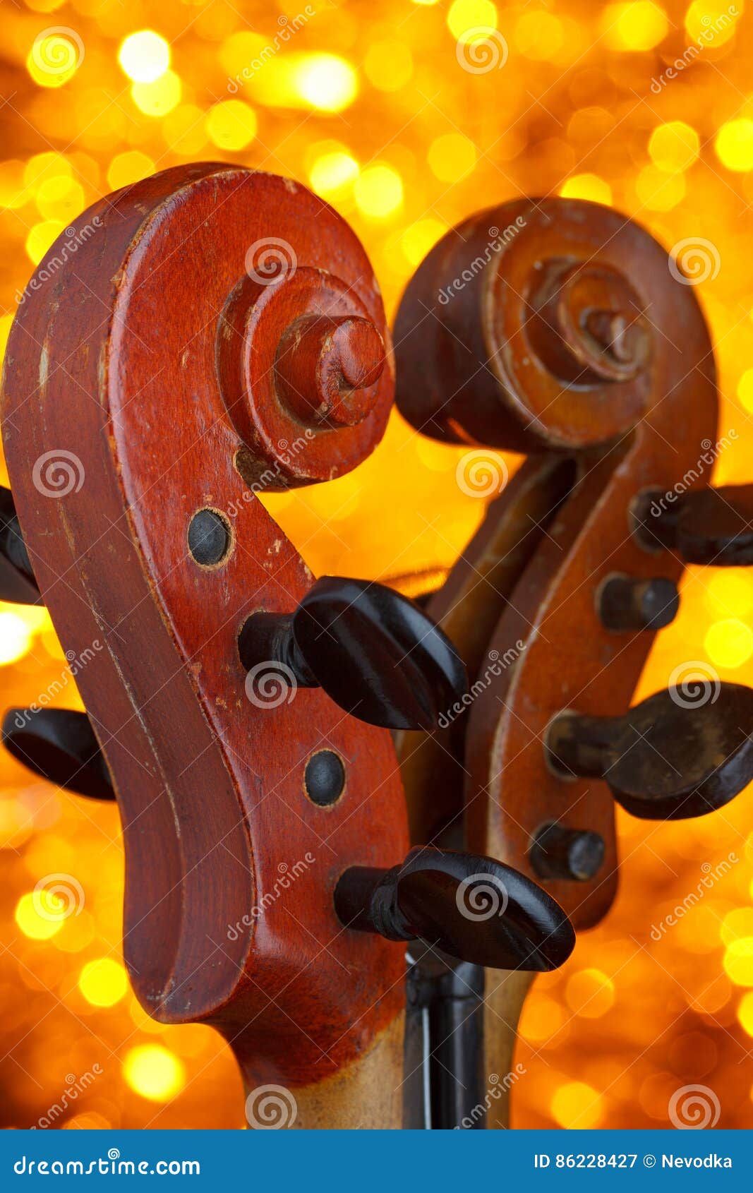 Two Vintage Violin Scrolls on Bokeh Background Stock Image - Image of ...