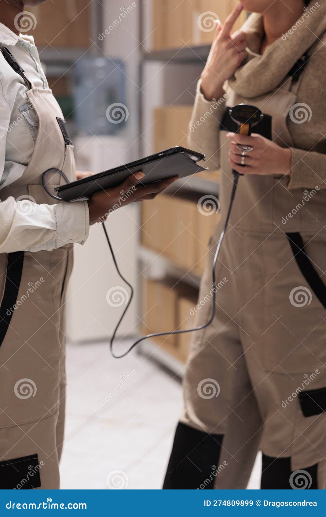 Two Warehouse Operators Discussing Parcels Audit in Inventory Software ...