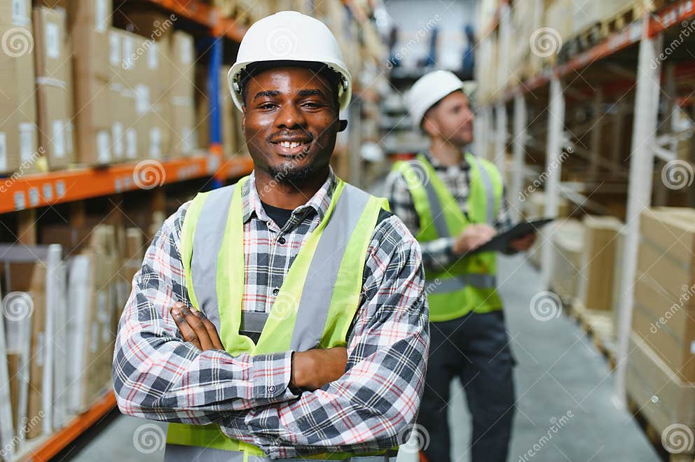 Two Warehouse Workers Checking and Controlling Boxes in Warehouse ...