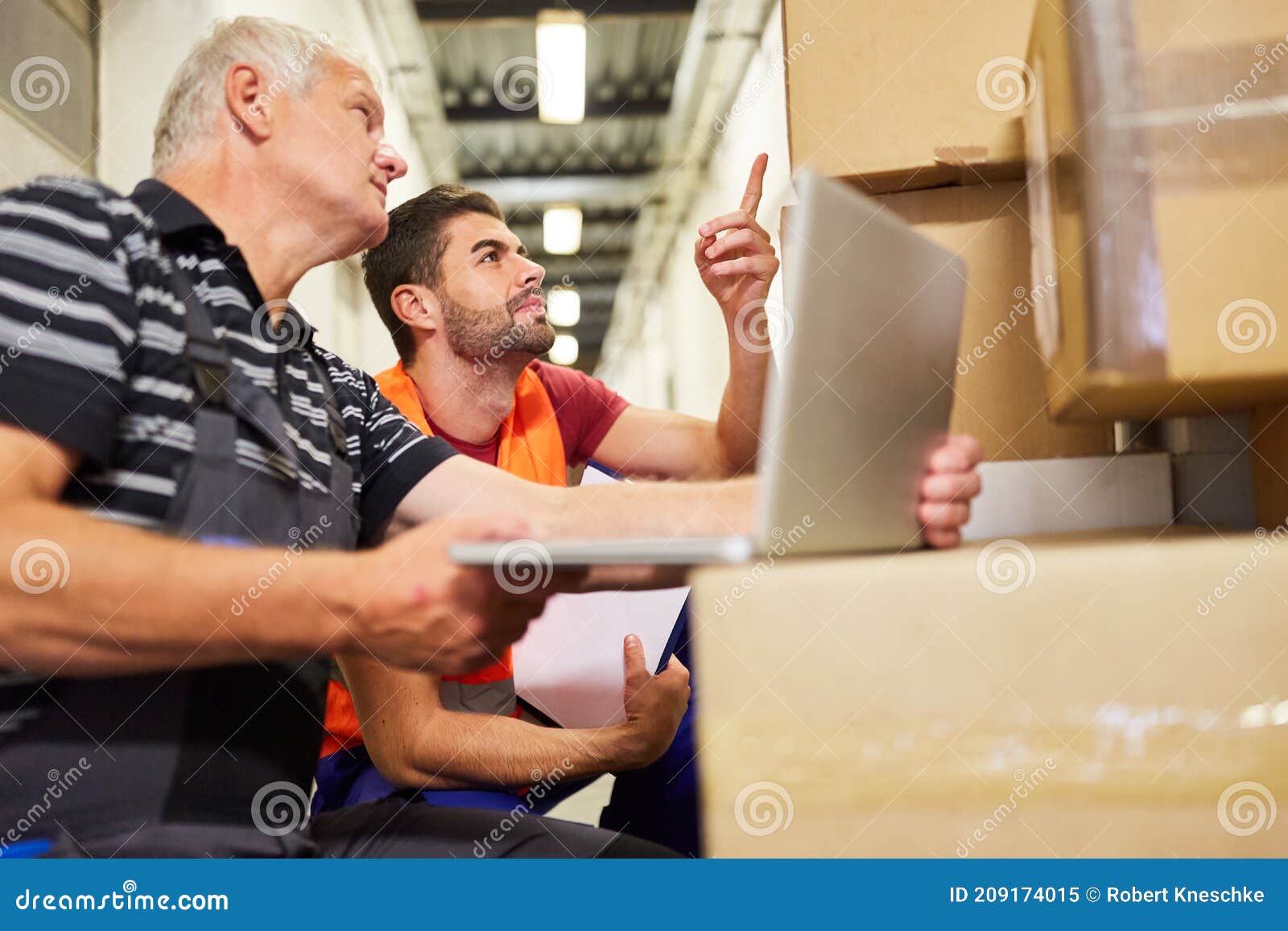 Warehouse Worker at Laptop Computer with Packages Stock Image - Image ...