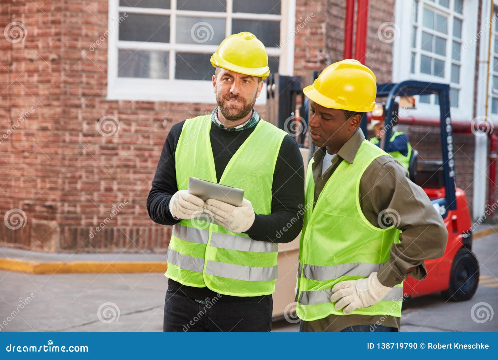 Two Warehouse Workers with Tablet Computer Stock Photo - Image of ...