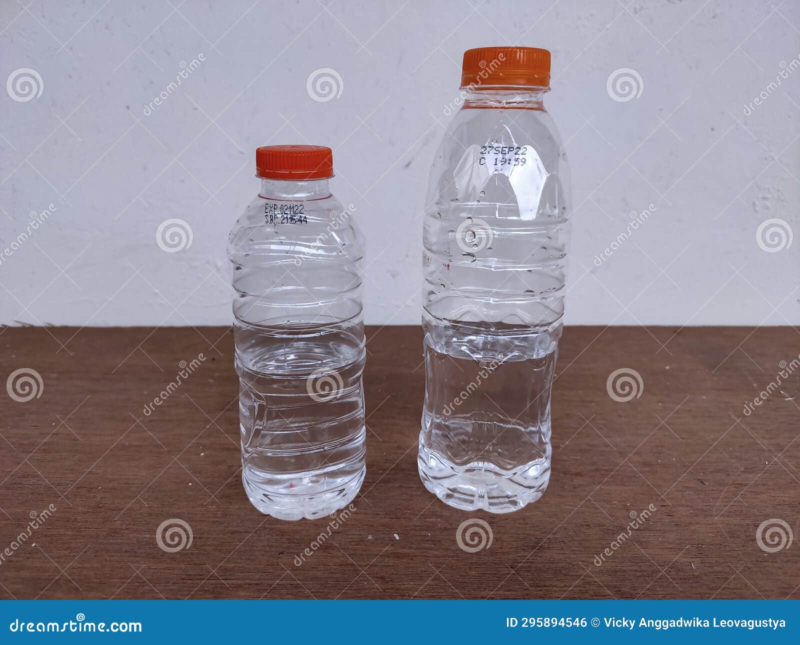 Two Water Bottles of Different Sizes Stock Photo - Image of white, wine ...
