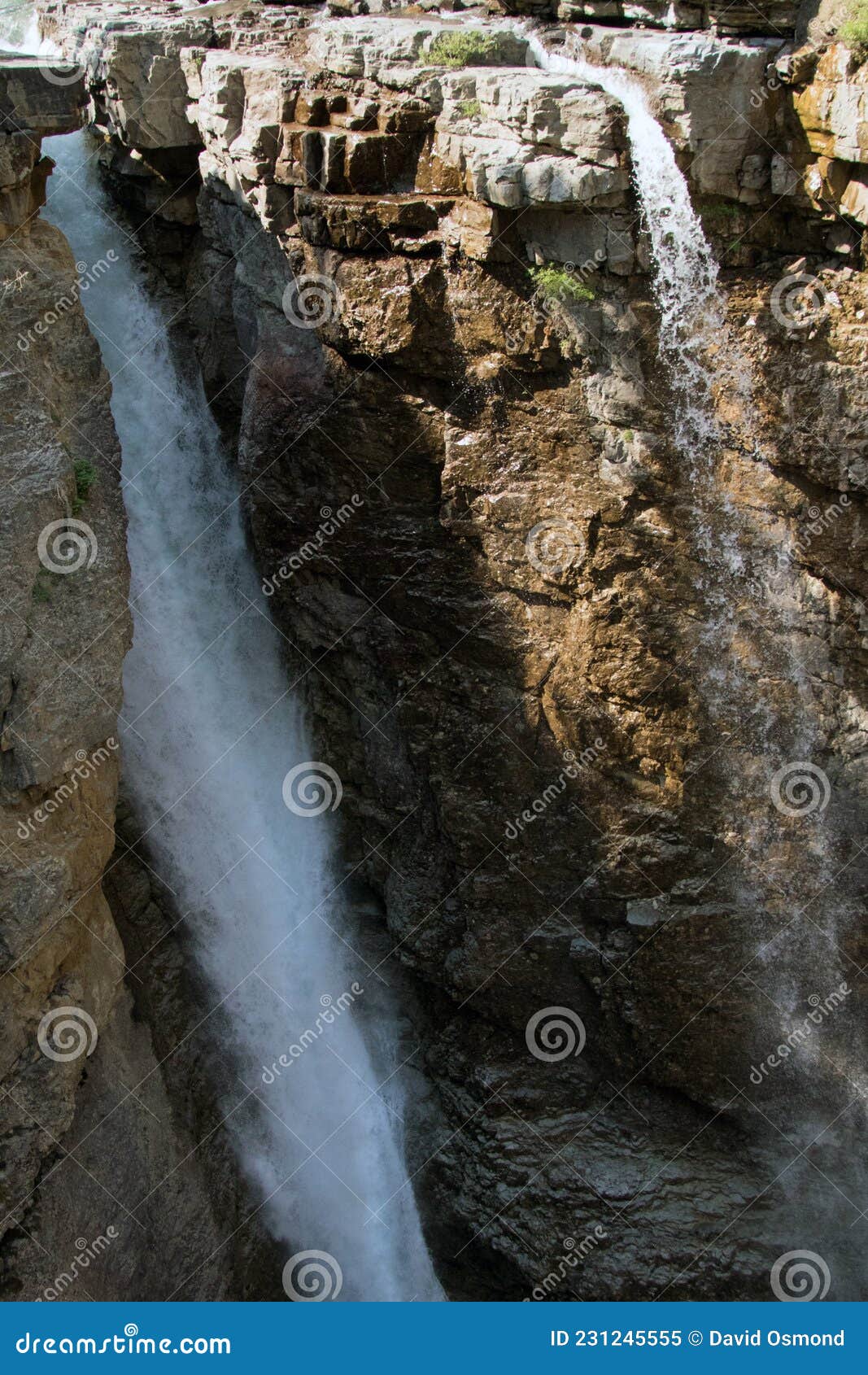 Two Waterfalls Flowing Over a Rock Cliff Stock Image - Image of beauty ...